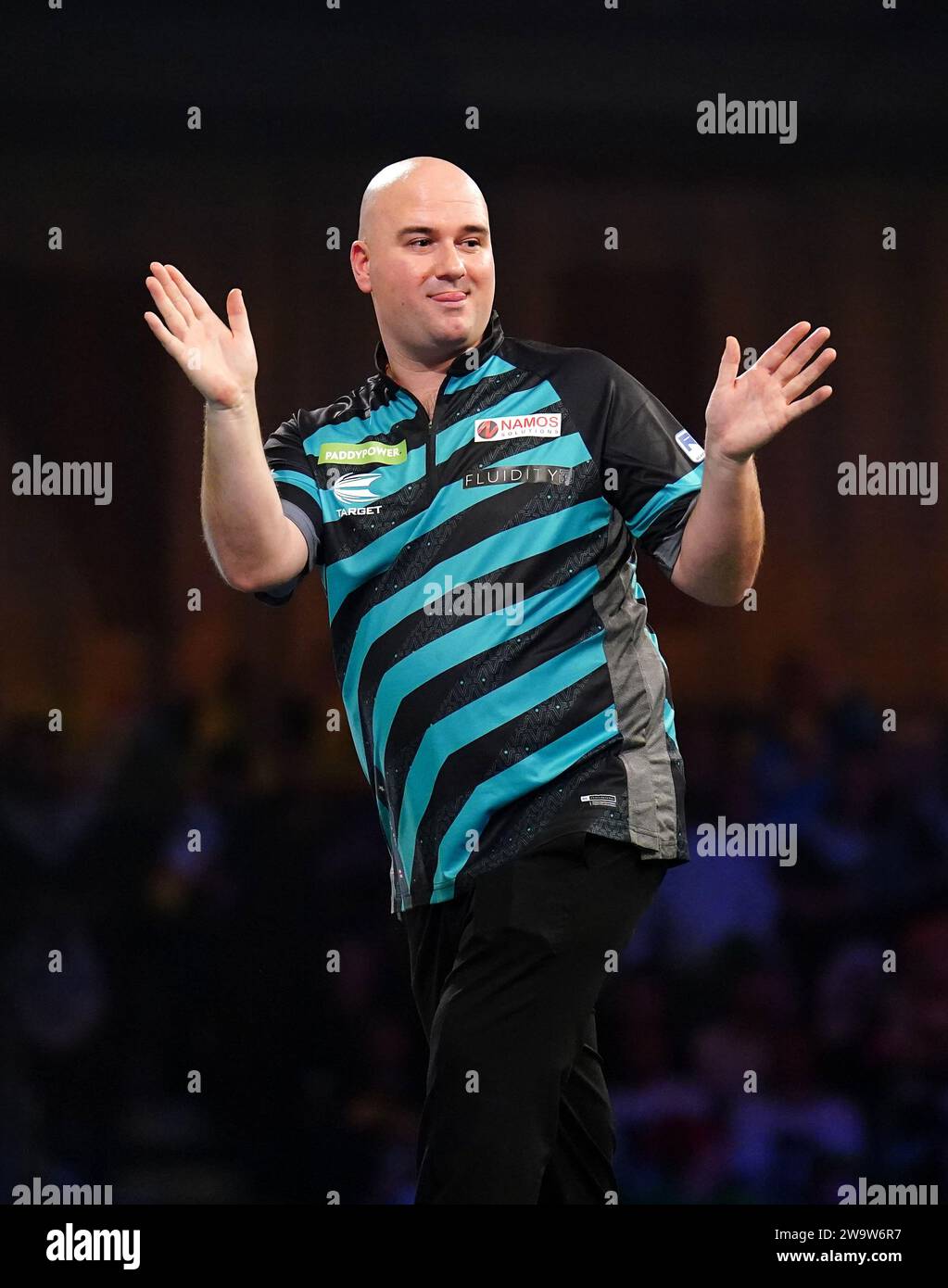 Rob Cross in action against Jonny Clayton (not pictured) on day ...
