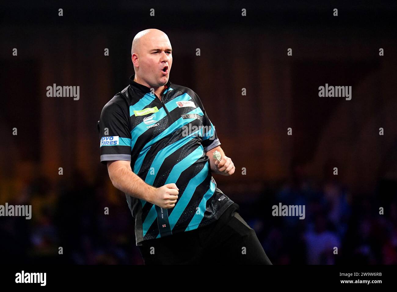 Rob Cross celebrates after beating Jonny Clayton (not pictured) on day ...