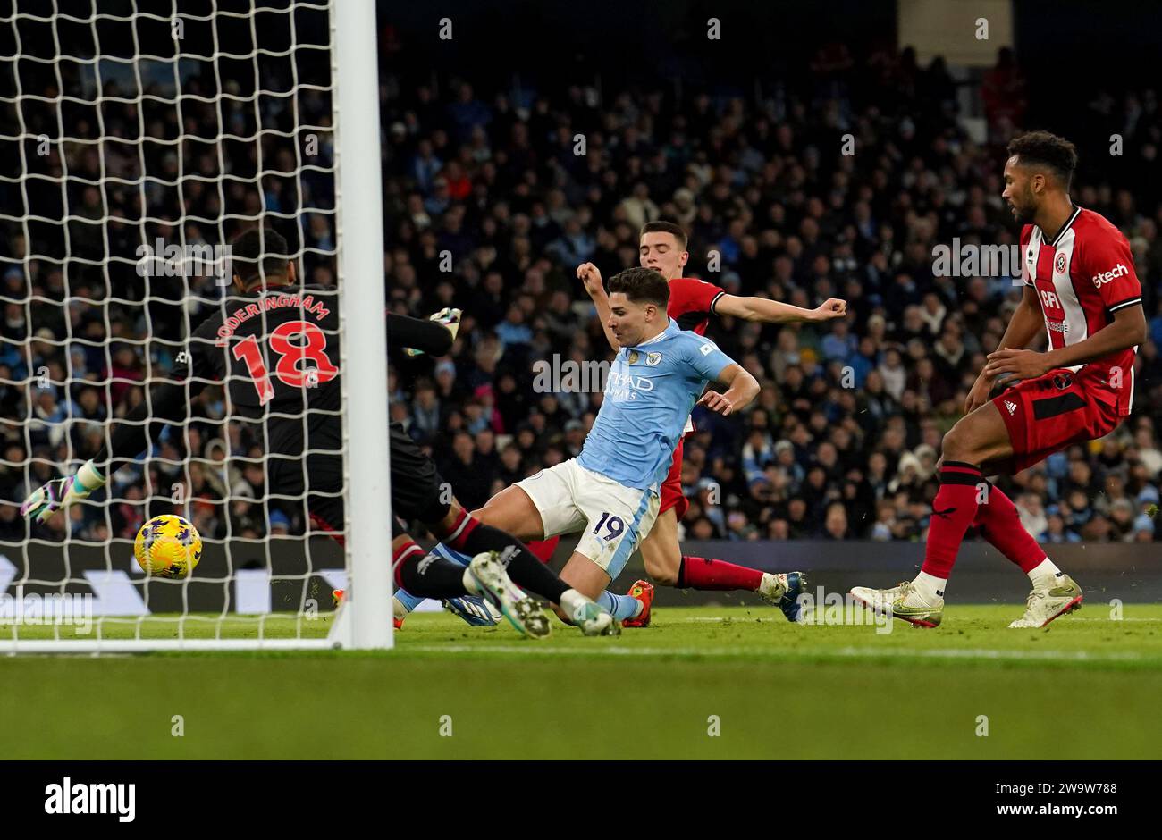 Manchester City's Julian Alvarez scores their side's second goal of the ...