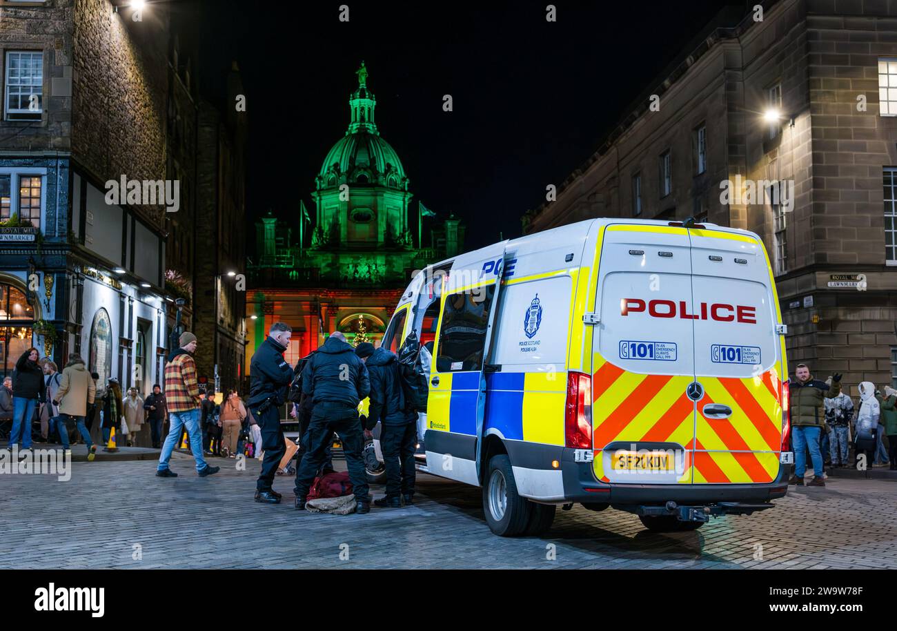 Police officers and police van incident on Royal Mile at night ...