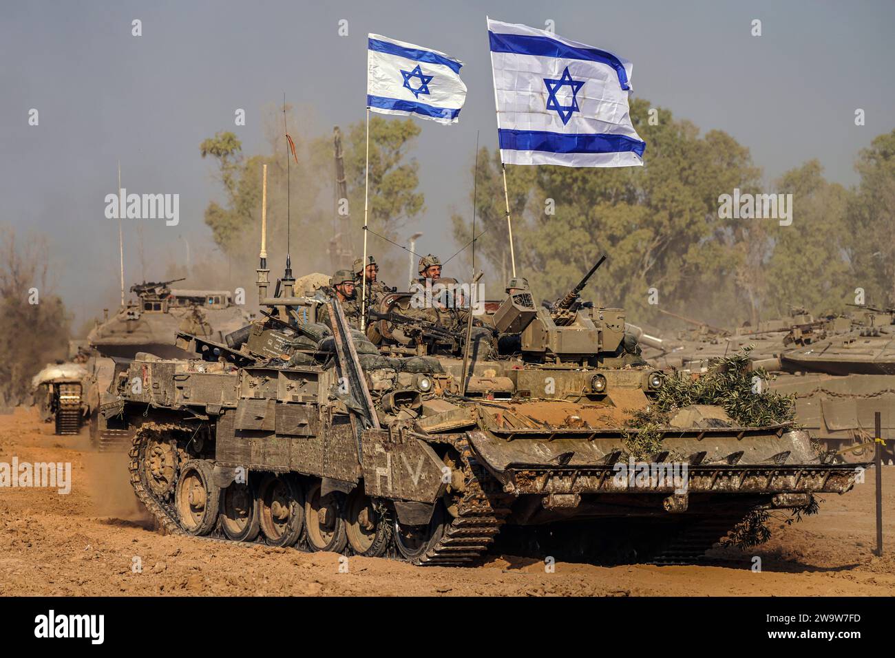 Israeli army vehicles arrive to an staging area after combat in the ...