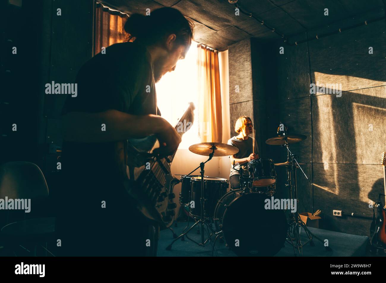 Musicians rehearsing in sound recording studio. Music band repetition ...
