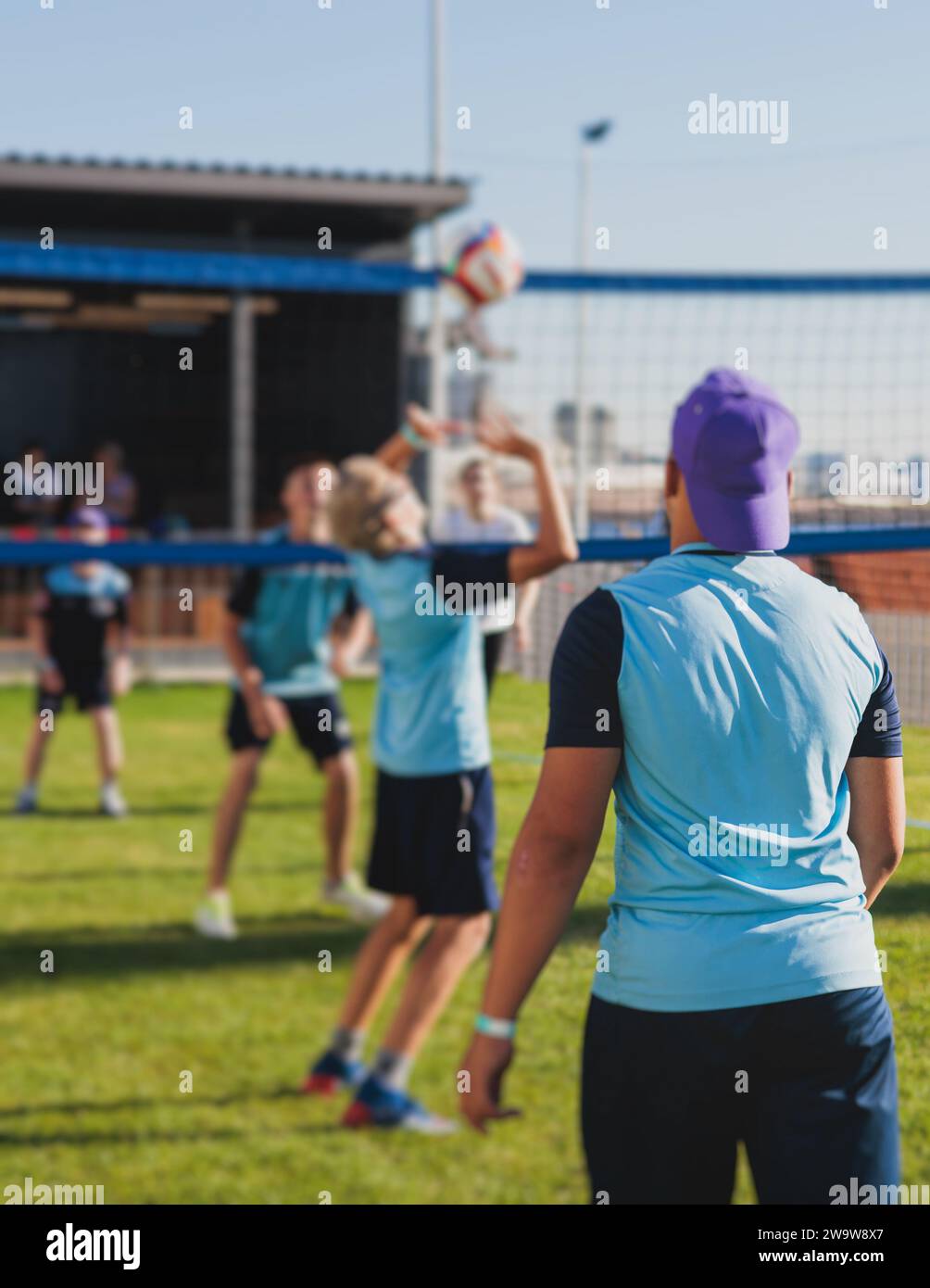 Volleyball game, junior teenage school team of kids play volleyball ...