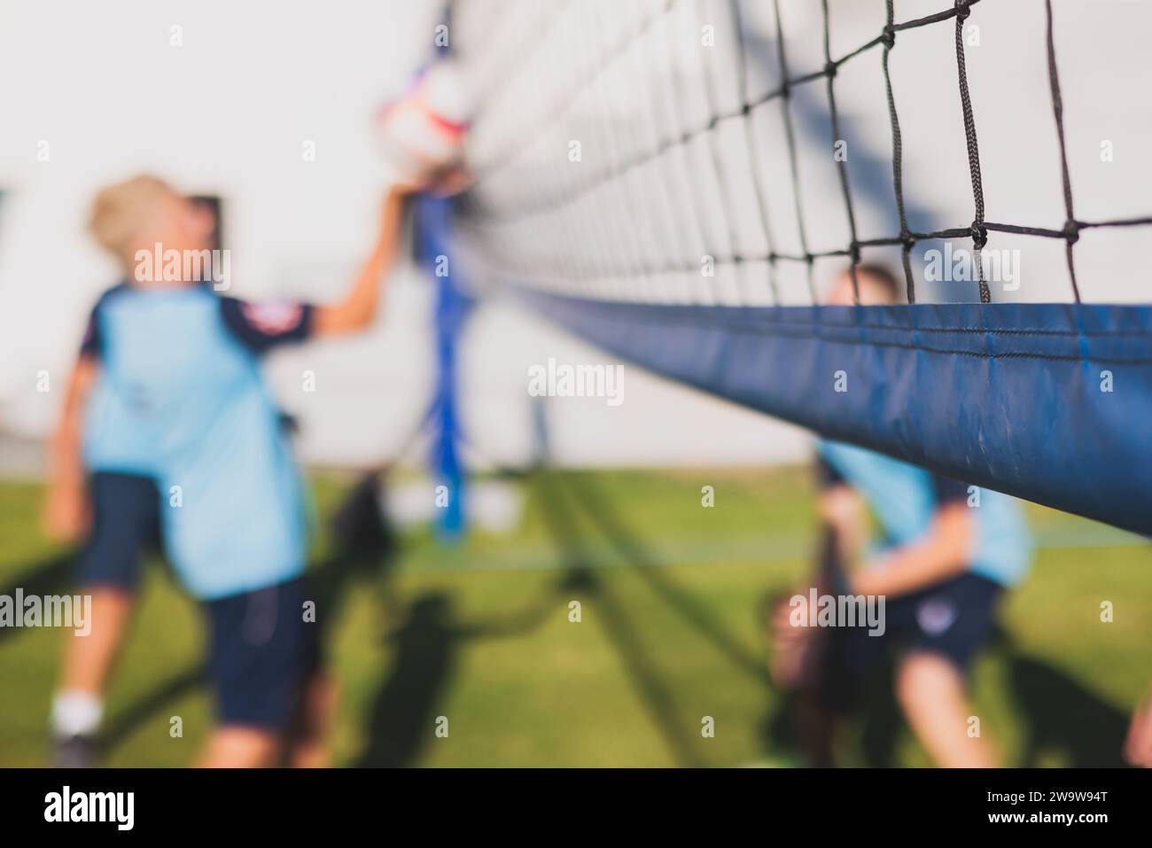 Volleyball game, junior teenage school team of kids play volleyball ...