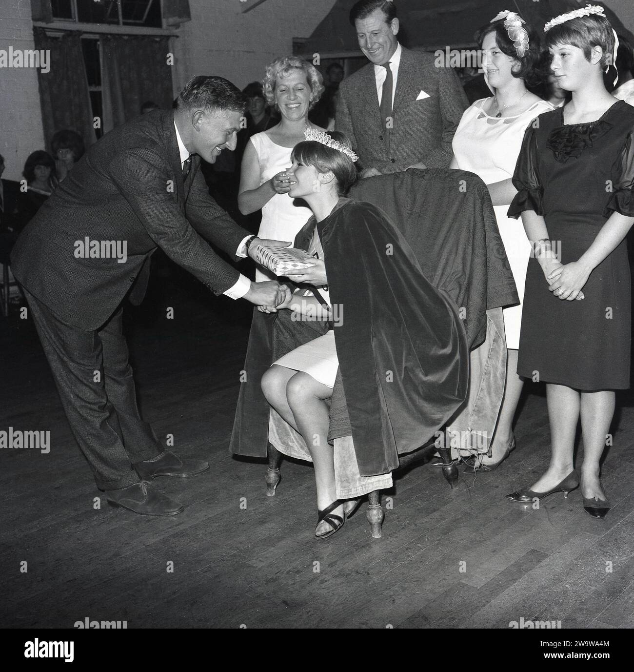 1964, historical, beauty queen.... in the middle of a village hall with ...