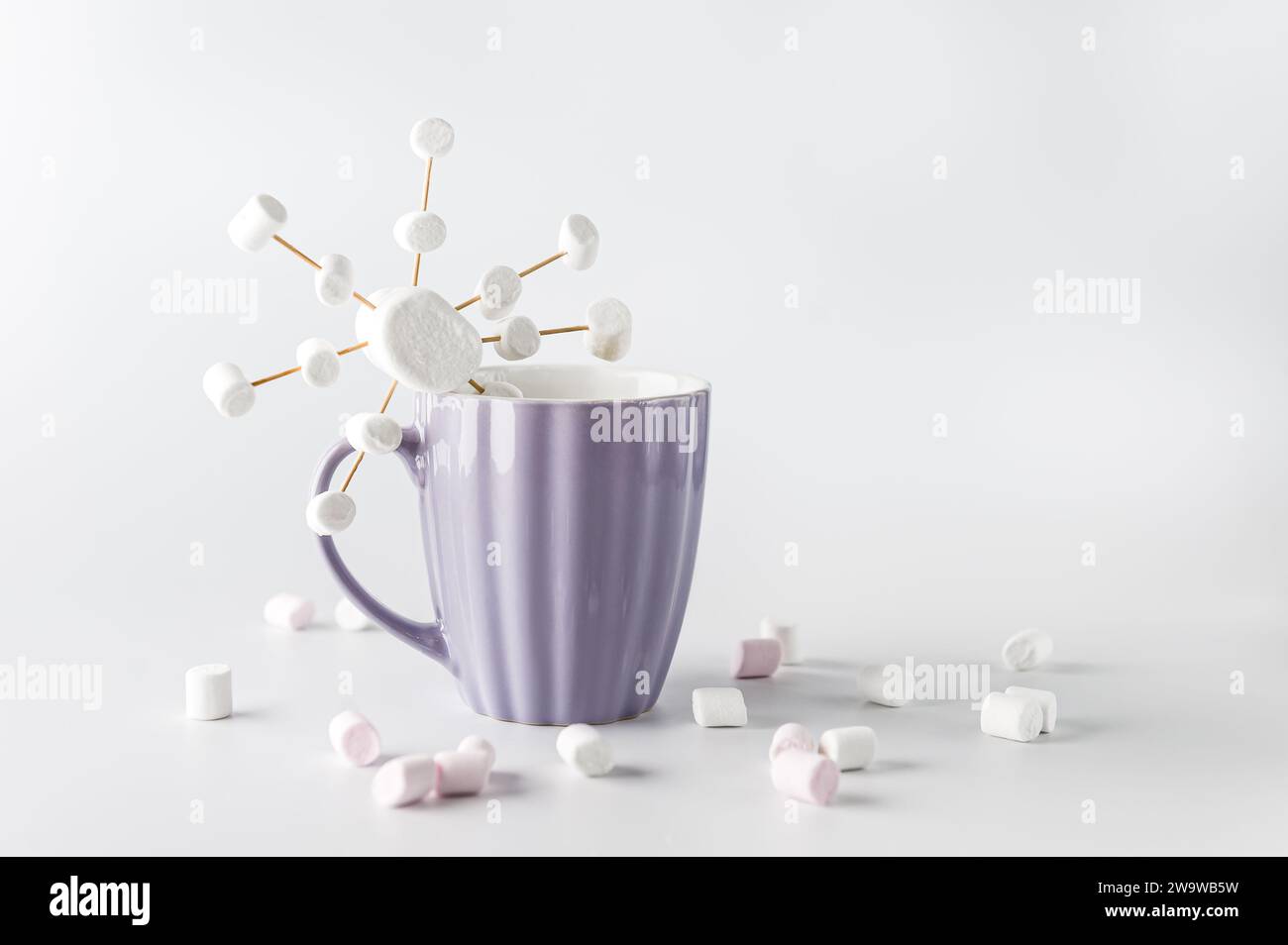 A purple mug with hot coffee and marshmallows. Cup with marshmallows in ...