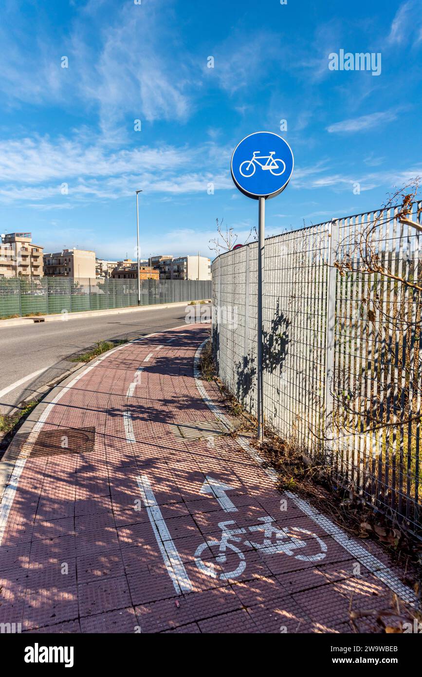 Road with cycle path and vertical and horizontal signs Stock Photo - Alamy