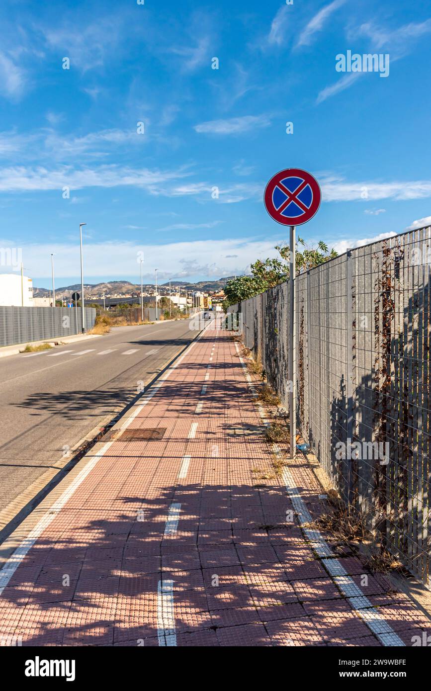 Isolated road with cycle path Stock Photo - Alamy