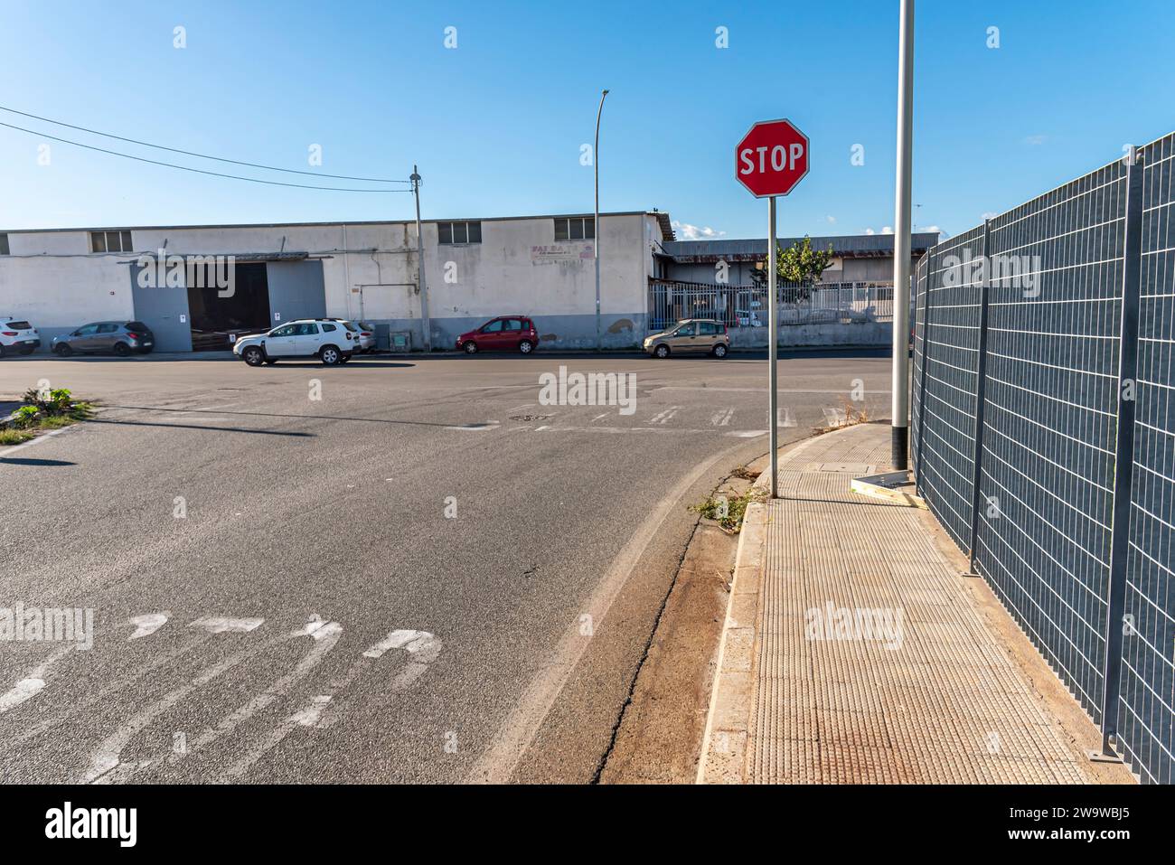 Crossroad with stop sign Stock Photo - Alamy