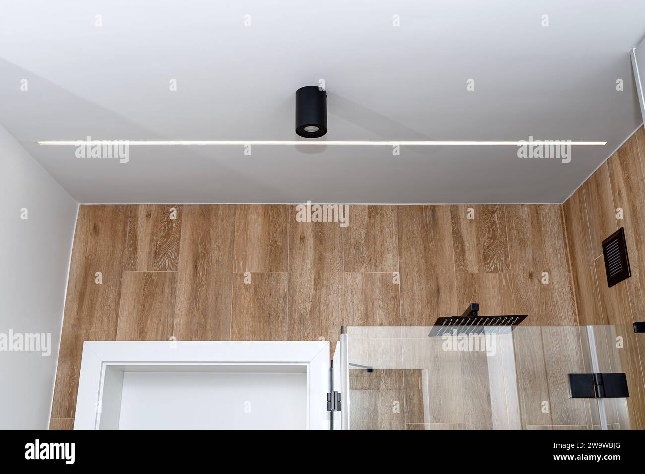 LED light strips mounted in the wall in a modern bathroom, visible ...