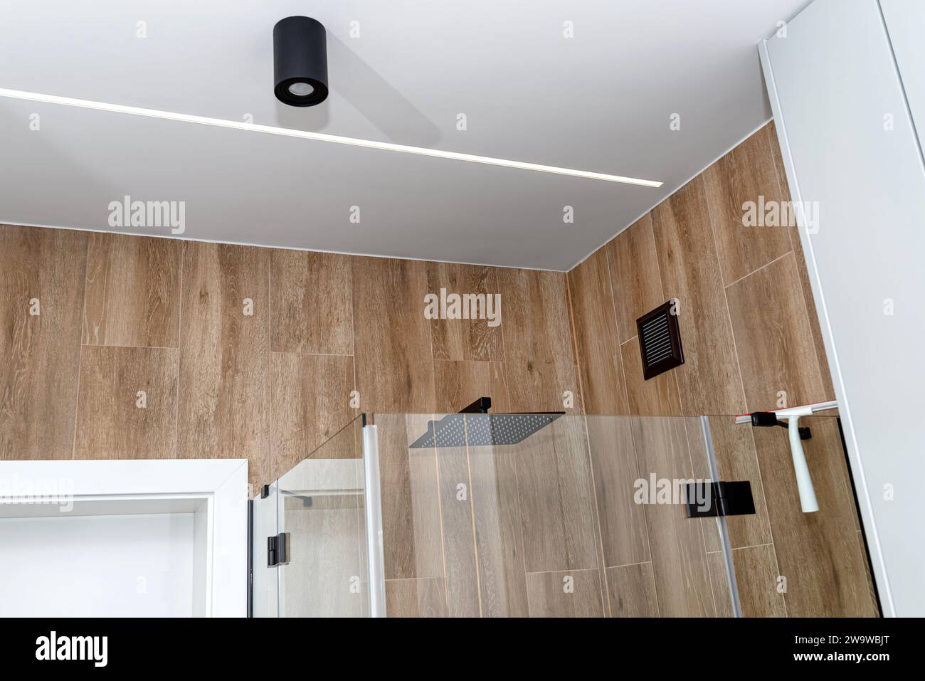 LED light strips mounted in the wall in a modern bathroom, visible ...