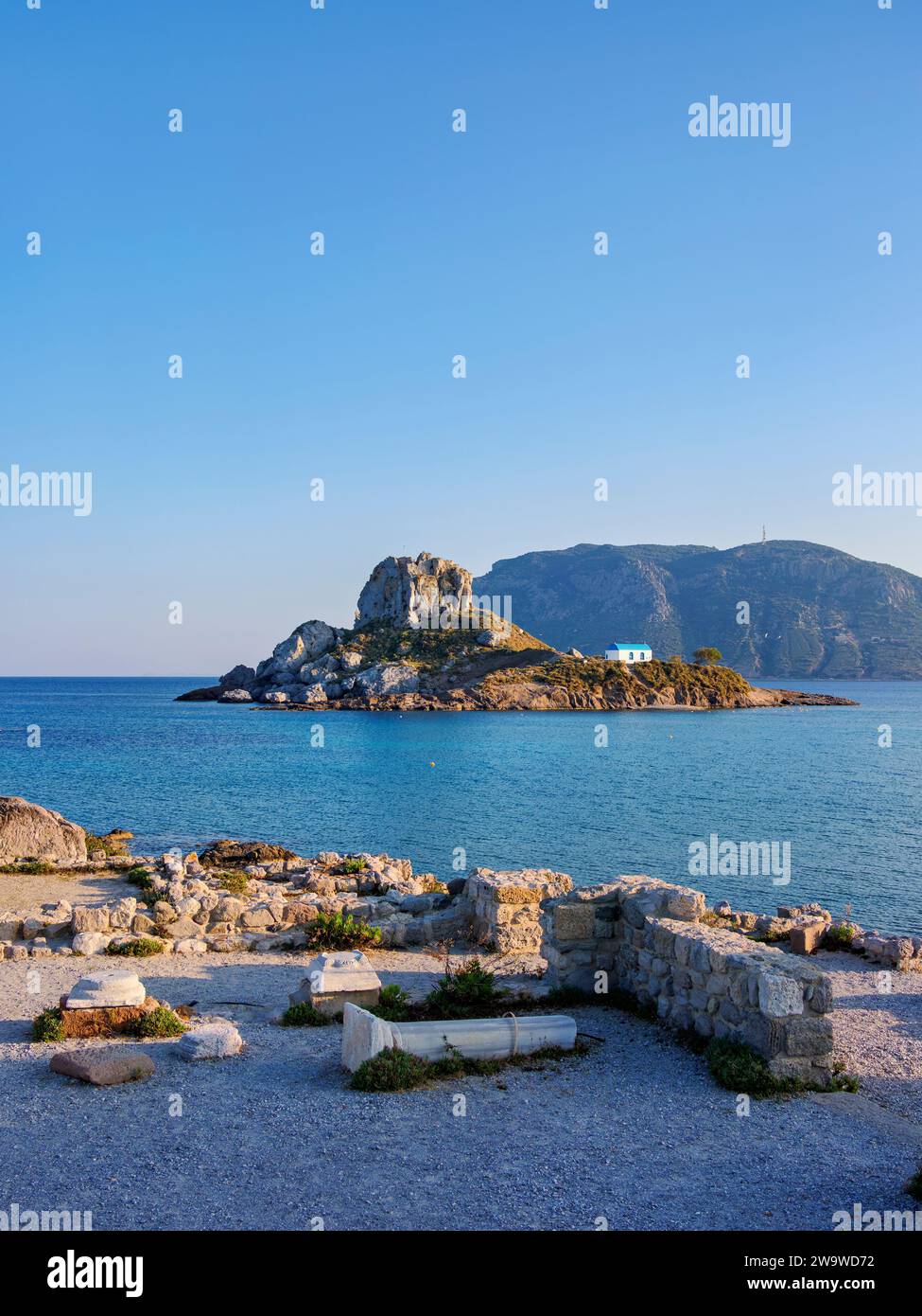 St. Stefanos Basilica Ruins and Kastri Island at sunset, Agios Stefanos ...