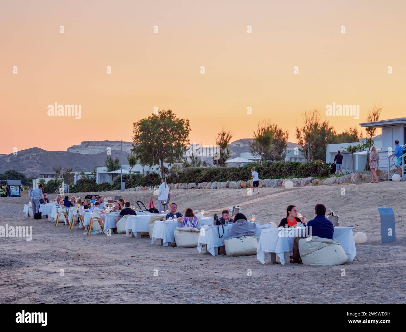 People eating al fresco at Agios Stefanos Beach, dusk, Kos Island ...