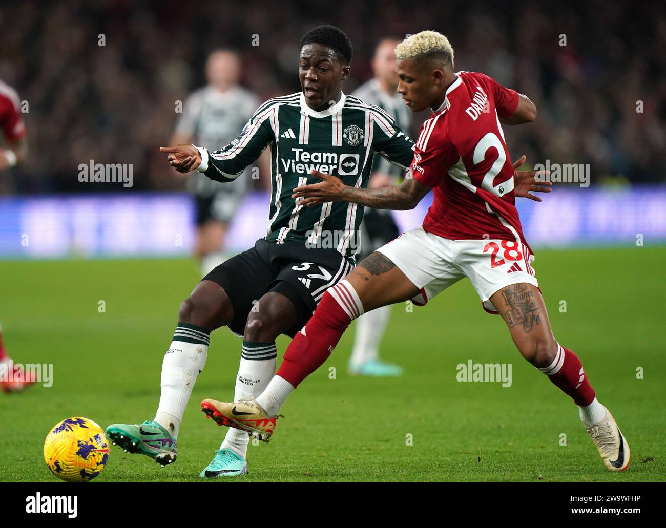 Manchester United's Kobbie Mainoo (left) and Nottingham Forest's Danilo ...