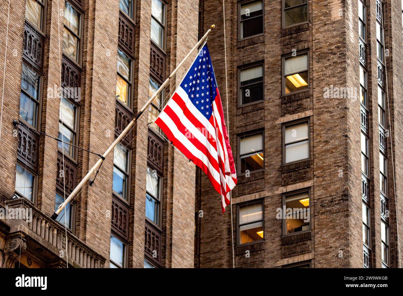 The beautiful big American flag flying on the skyscraper buildings of ...