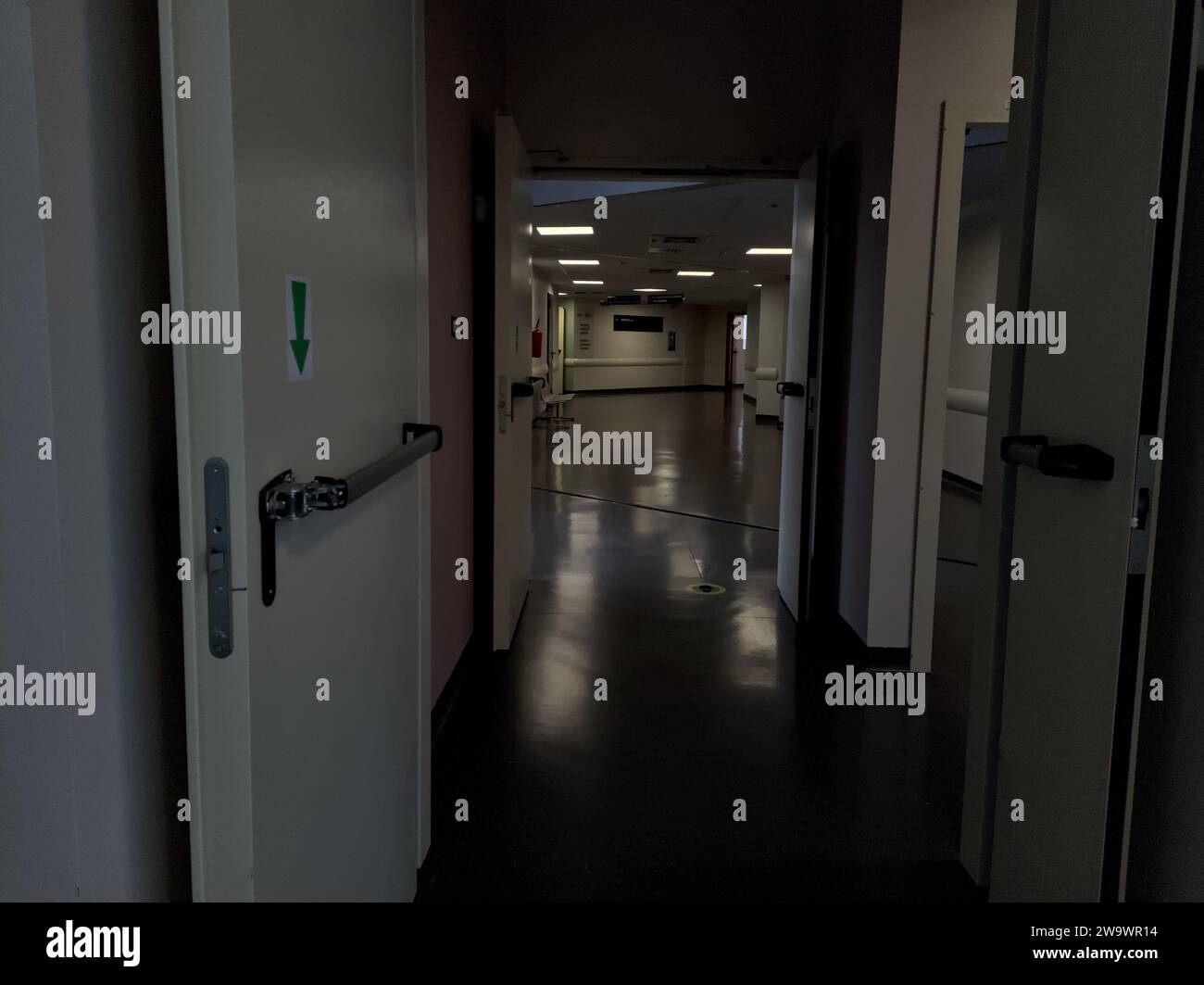 Corridor of a hospital with escape doors in it Stock Photo - Alamy