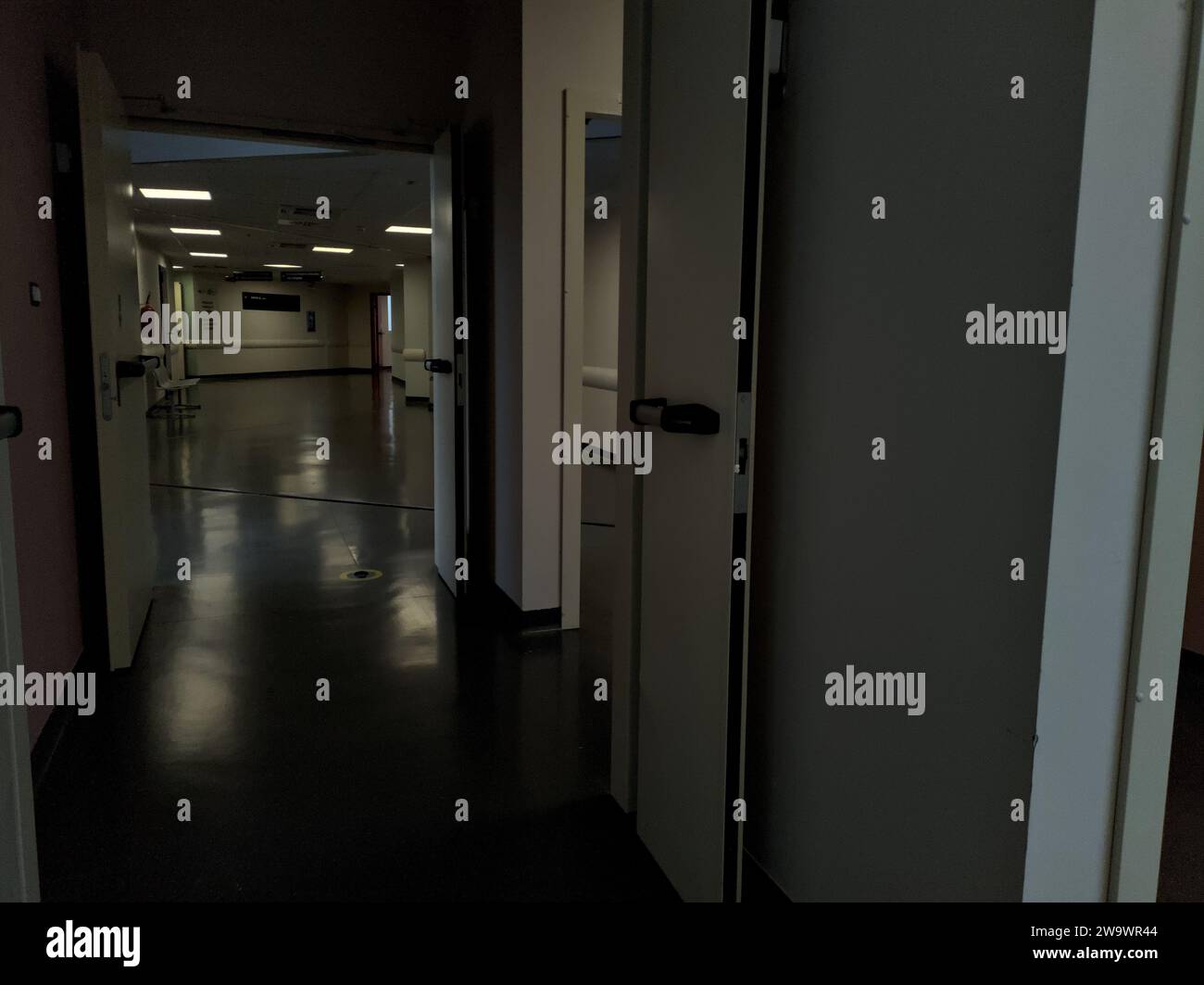 Corridor of a hospital with escape doors in it Stock Photo - Alamy