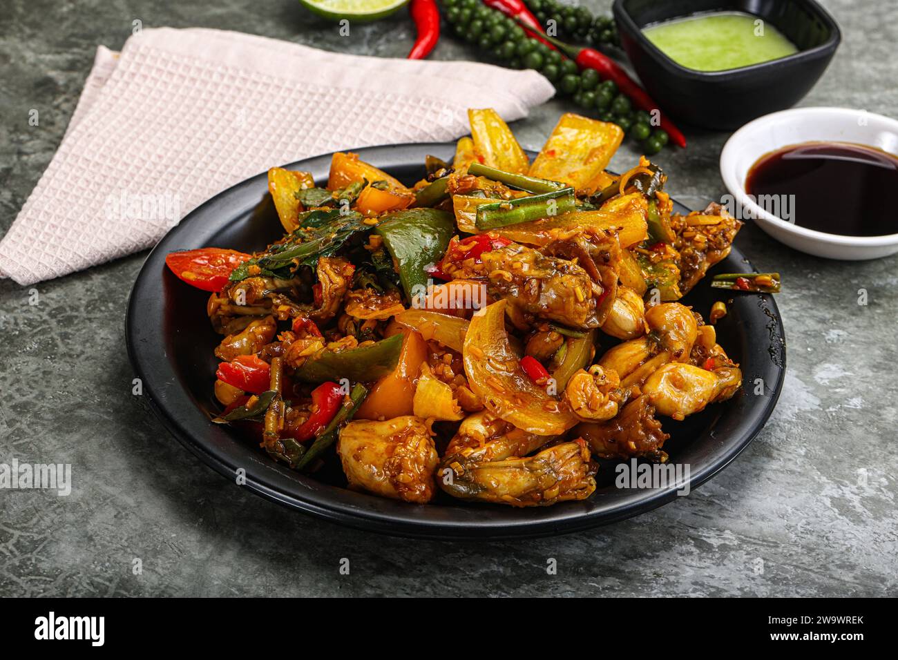 Vietnamese cuisine - fried frog with vegetables and spices Stock Photo ...