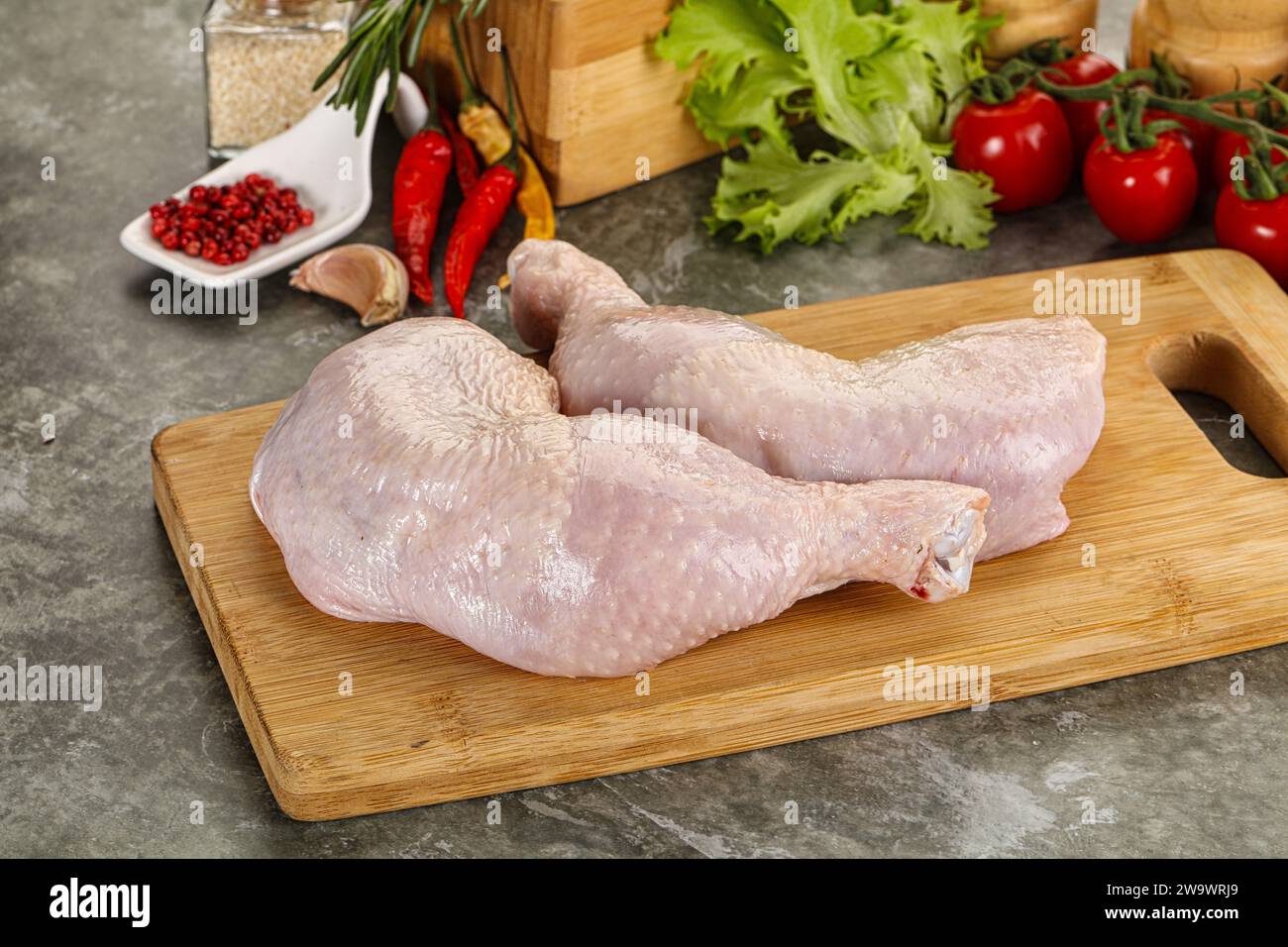 Raw chicken leg foe cooking over board Stock Photo - Alamy