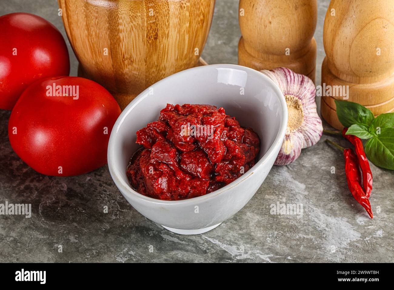 Natural organic red tomato paste in the bowl Stock Photo - Alamy