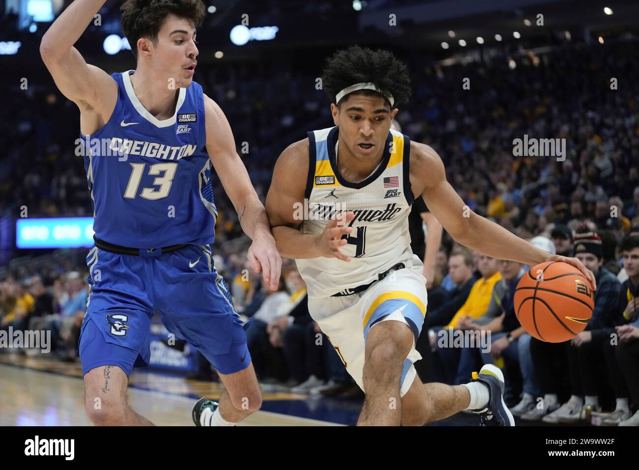 Marquette's Stevie Mitchell tries to get past Creighton's Mason Miller ...