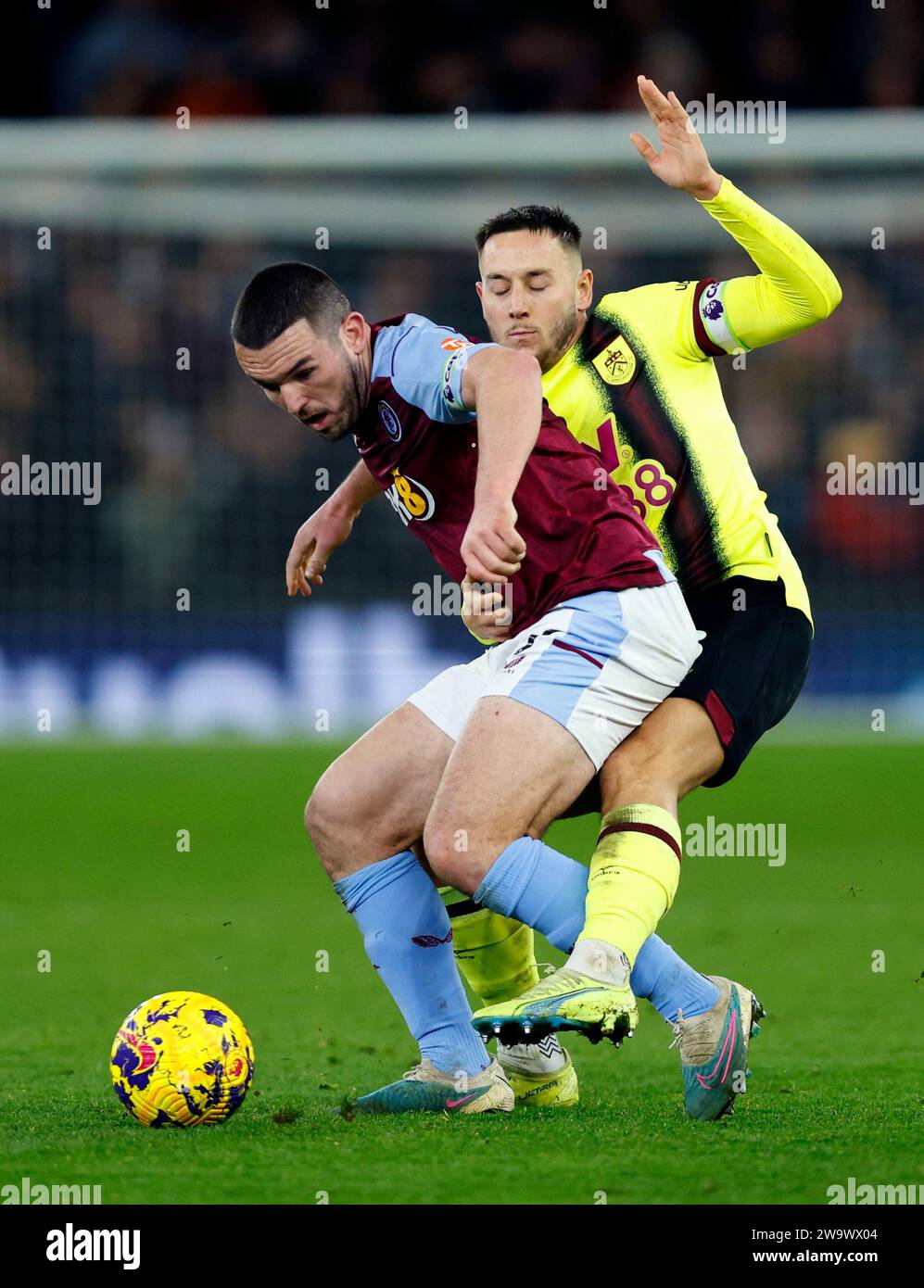 Aston Villa's John McGinn (left) and Burnley's Josh Brownhill battle ...