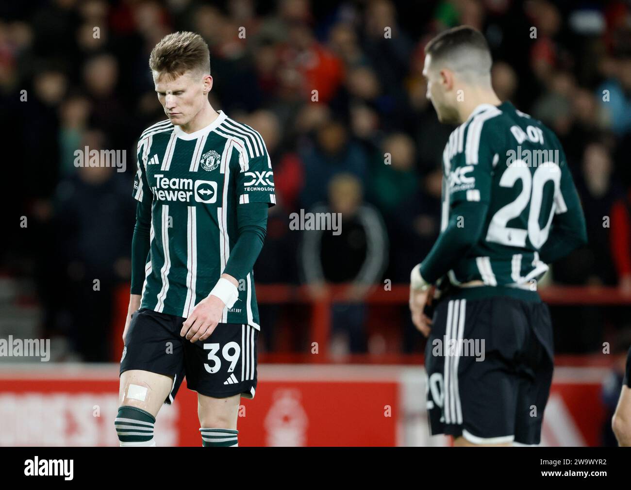Manchester United's Scott McTominay (left) reacts after his side ...