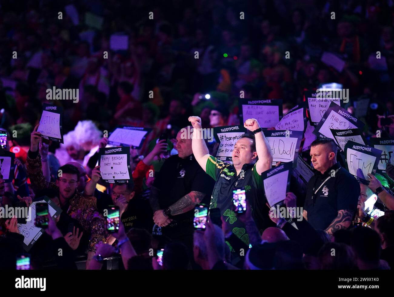Brendan Dolan walks out to play Gary Anderson (not pictured) on day ...