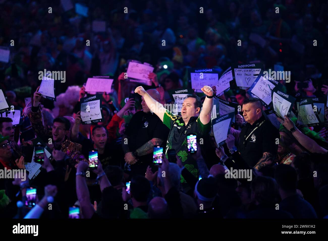 Brendan Dolan walks out to play Gary Anderson (not pictured) on day ...