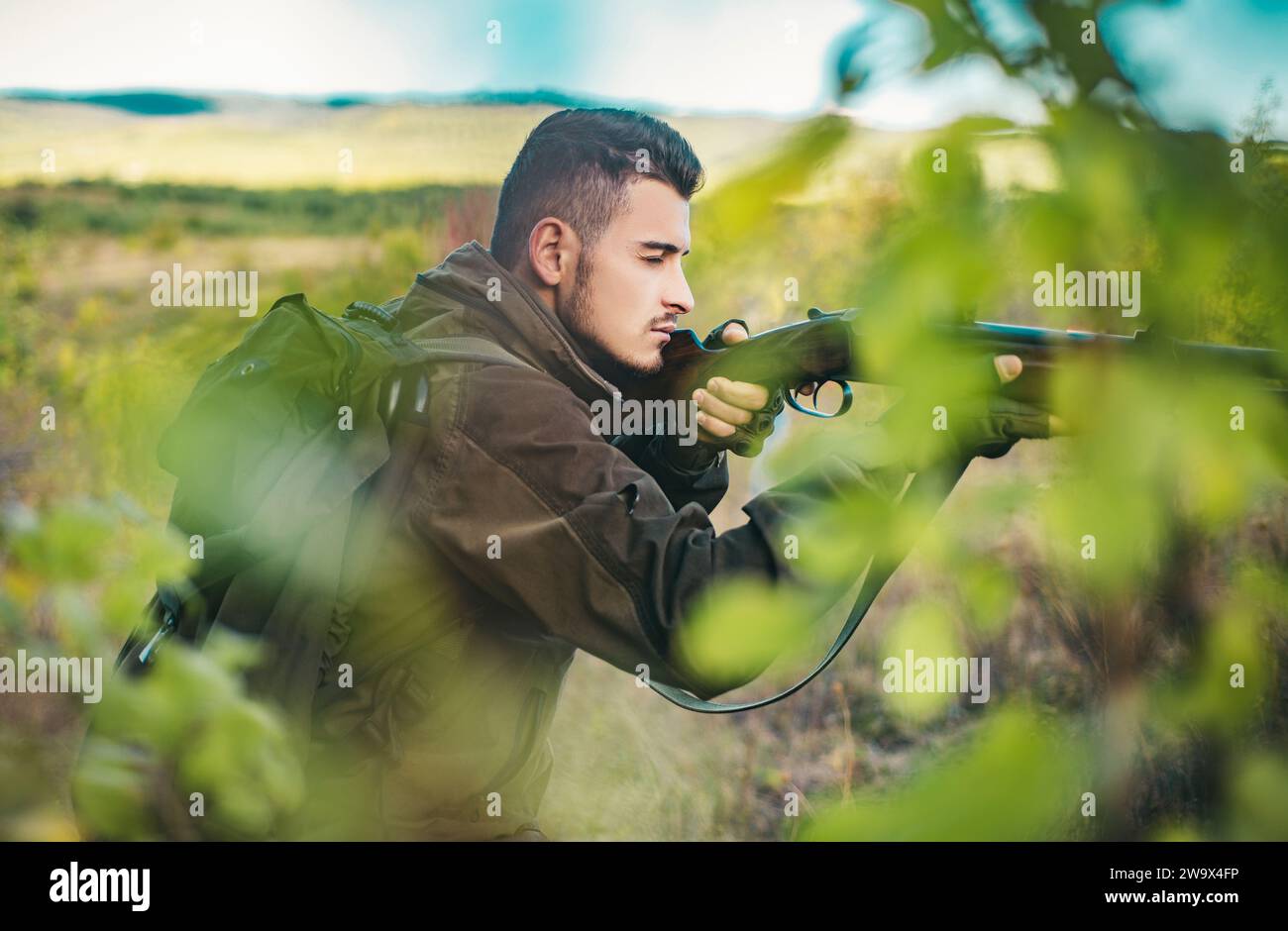 Hunter with shotgun gun on hunt. Hunter with Powerful Rifle with Scope ...