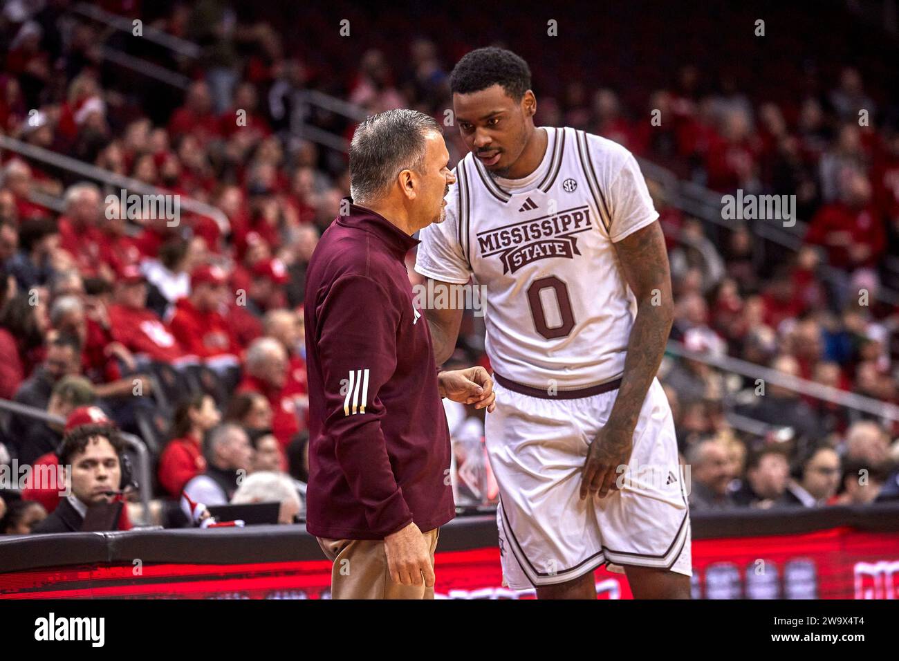 Mississippi State Bulldogs head coach Chris Jans talks with forward D.J ...