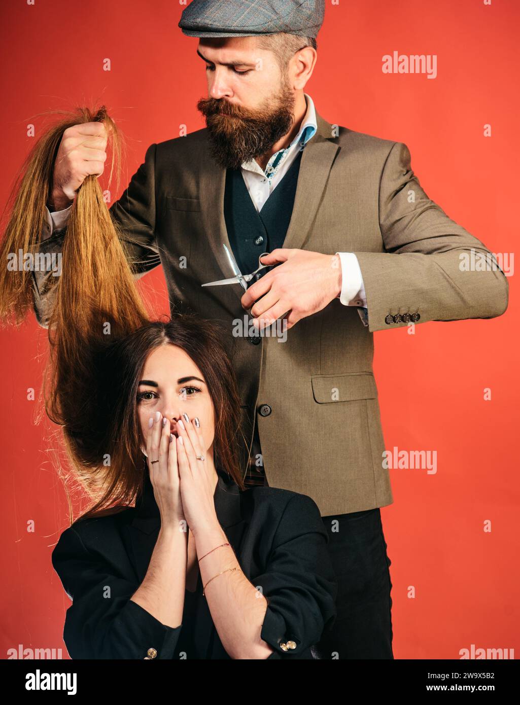 Hairdresser work on female haircut. Gorgeous hair. Woman with long hair ...