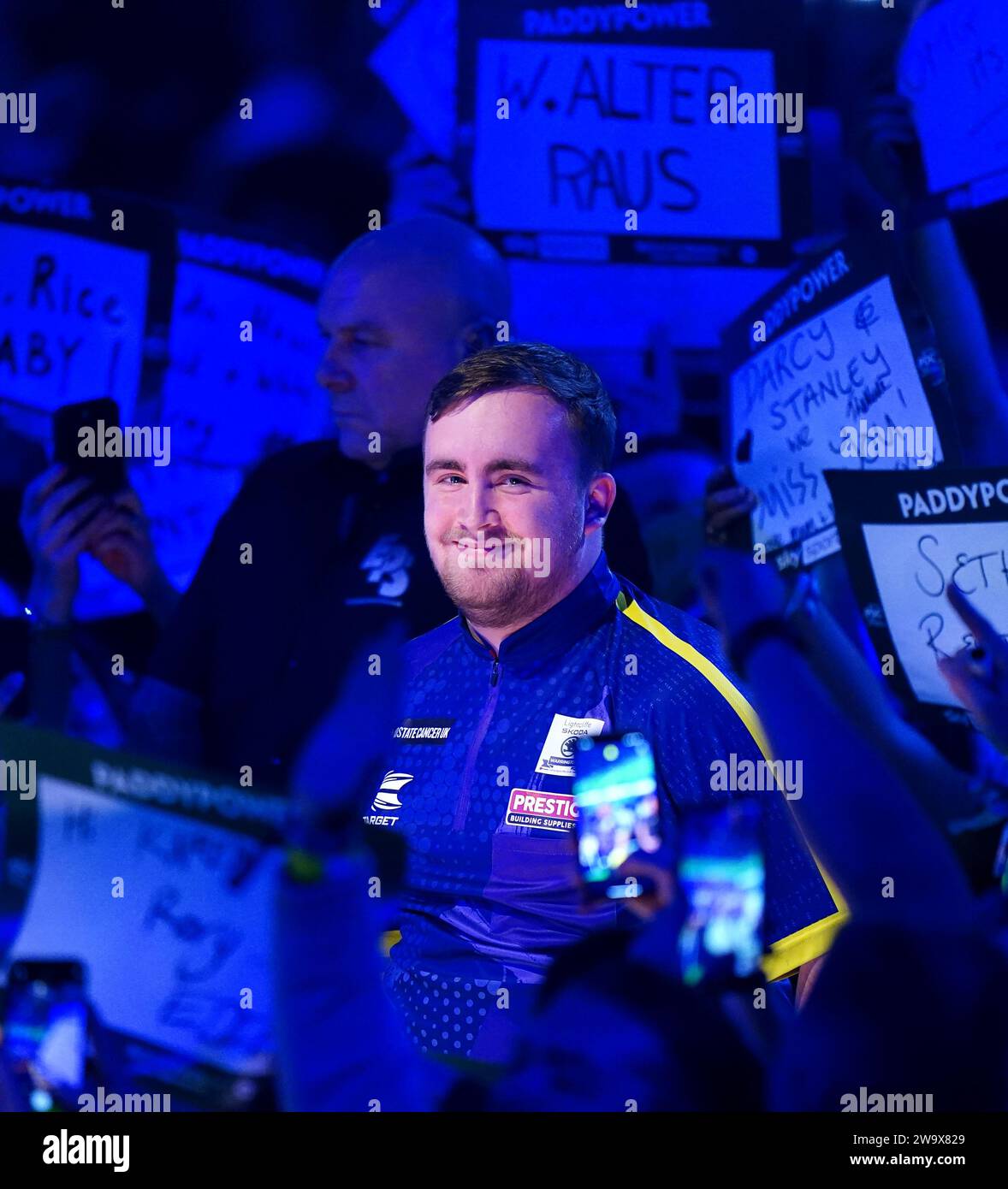 Luke Littler walks out to play Raymond van Barneveld (not pictured) on ...