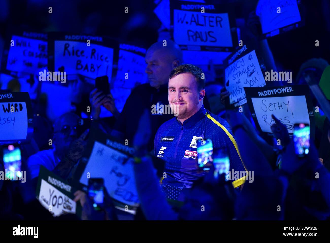 Luke Littler walks out to play Raymond van Barneveld (not pictured) on ...