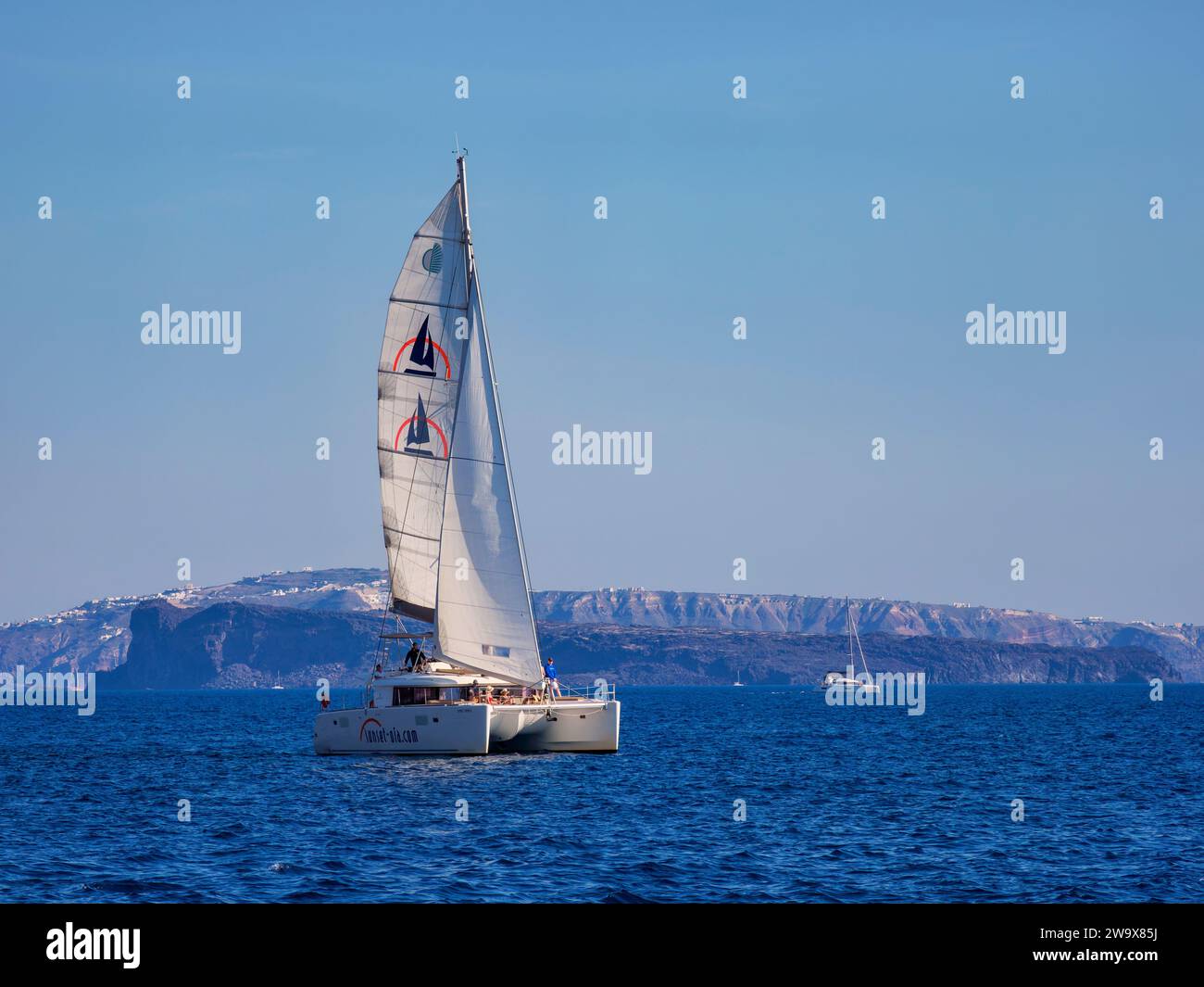 Catamaran at the caldera, Santorini or Thira Island, Cyclades, Greece ...