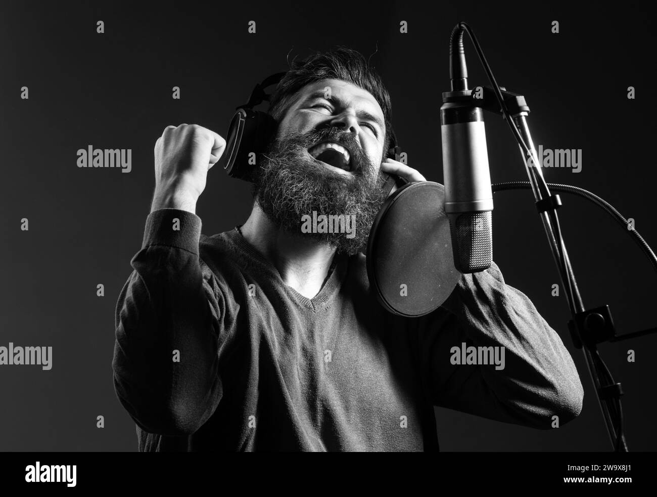 Singer singing rock. Expression face close up. Sound producer recording ...