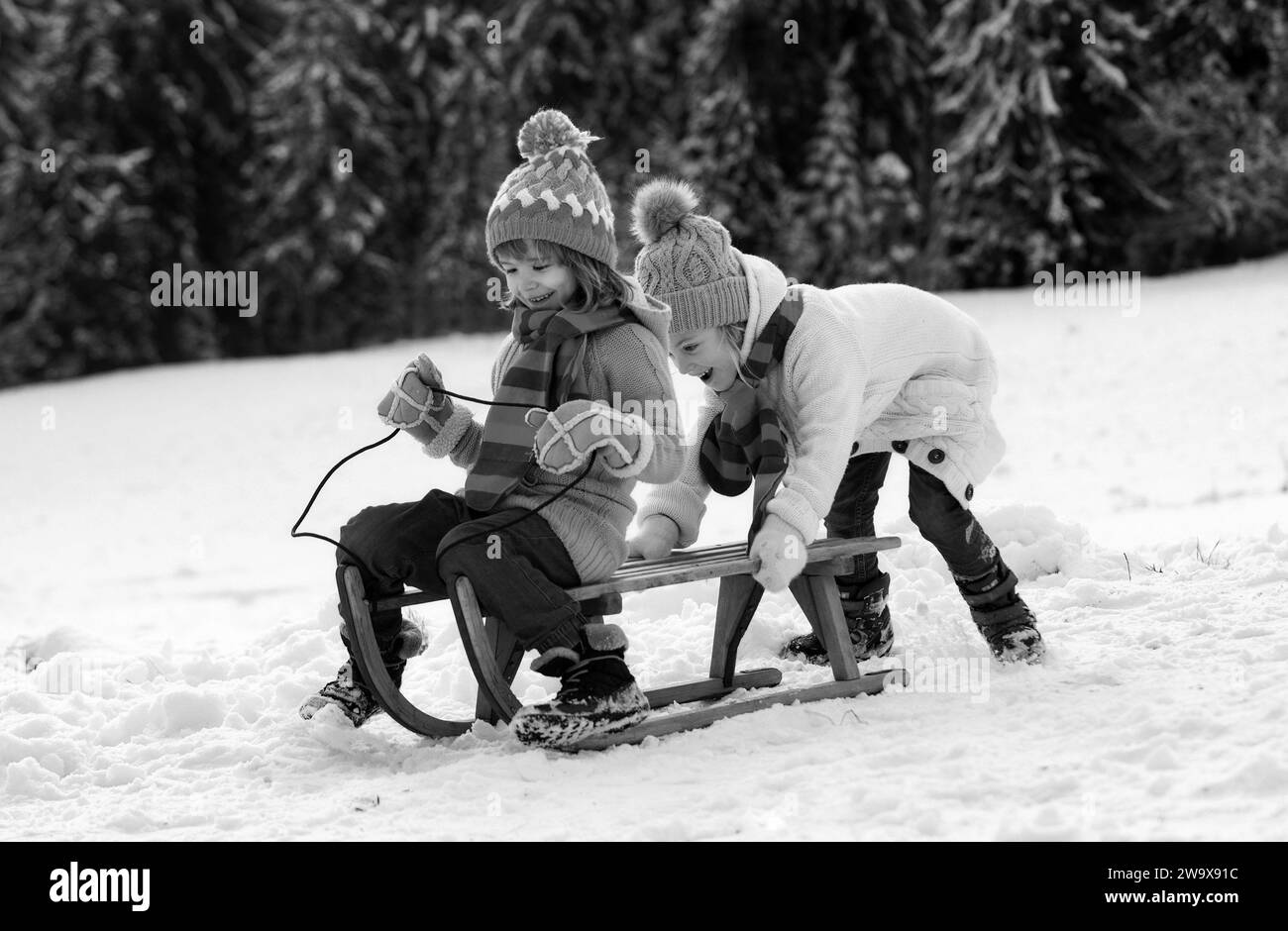 Brother sister riding together in Black and White Stock Photos & Images ...