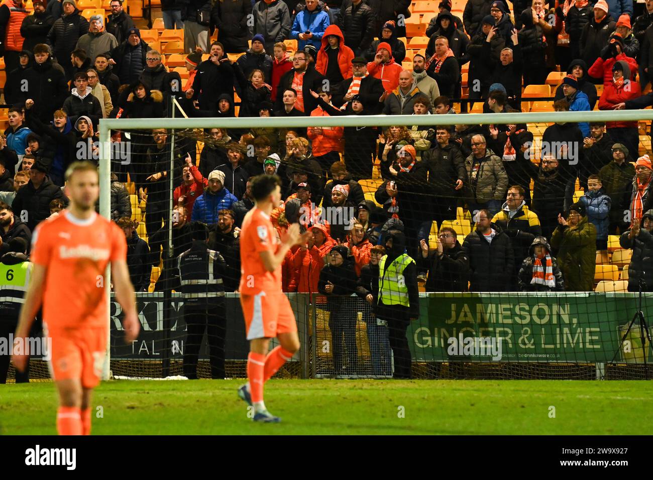 Burslem, UK, 29th December 2023. Blackpool fans show a mixed reaction ...