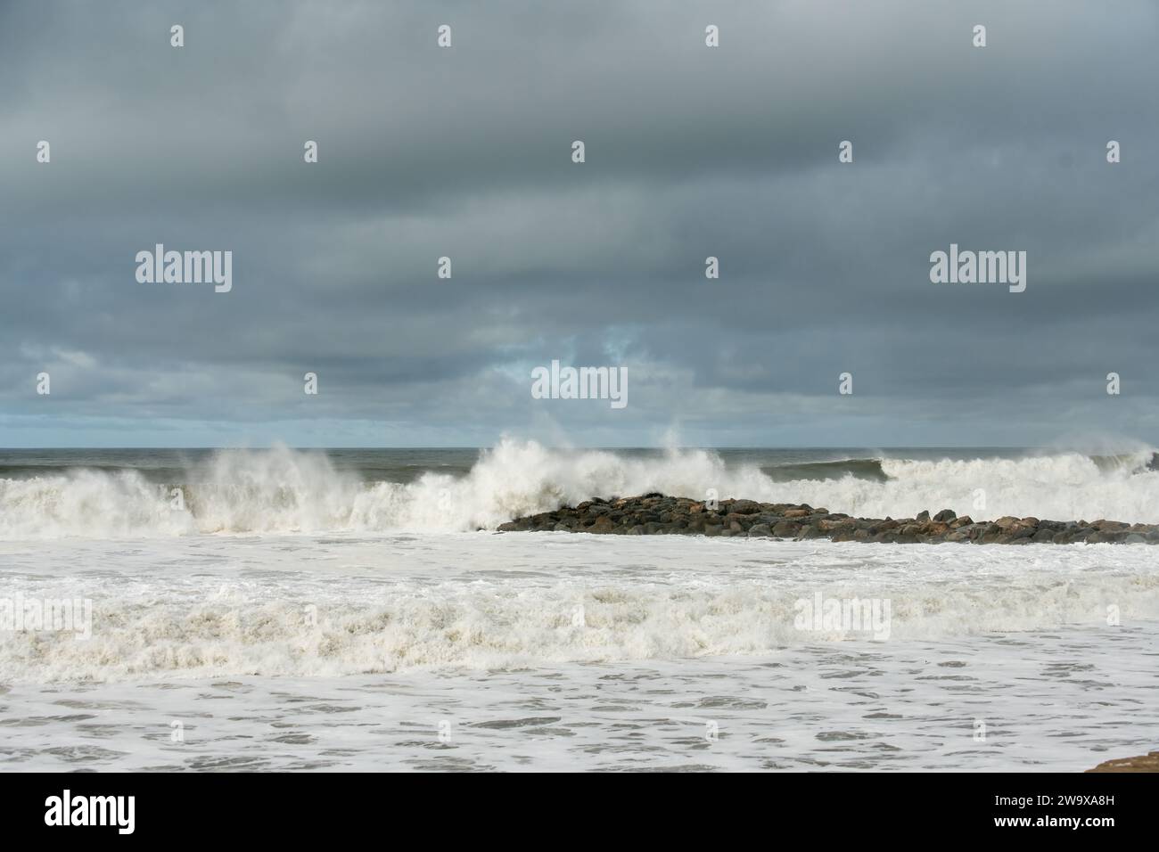 Ventura rock jetty is submerged under crashing waves from the high ...