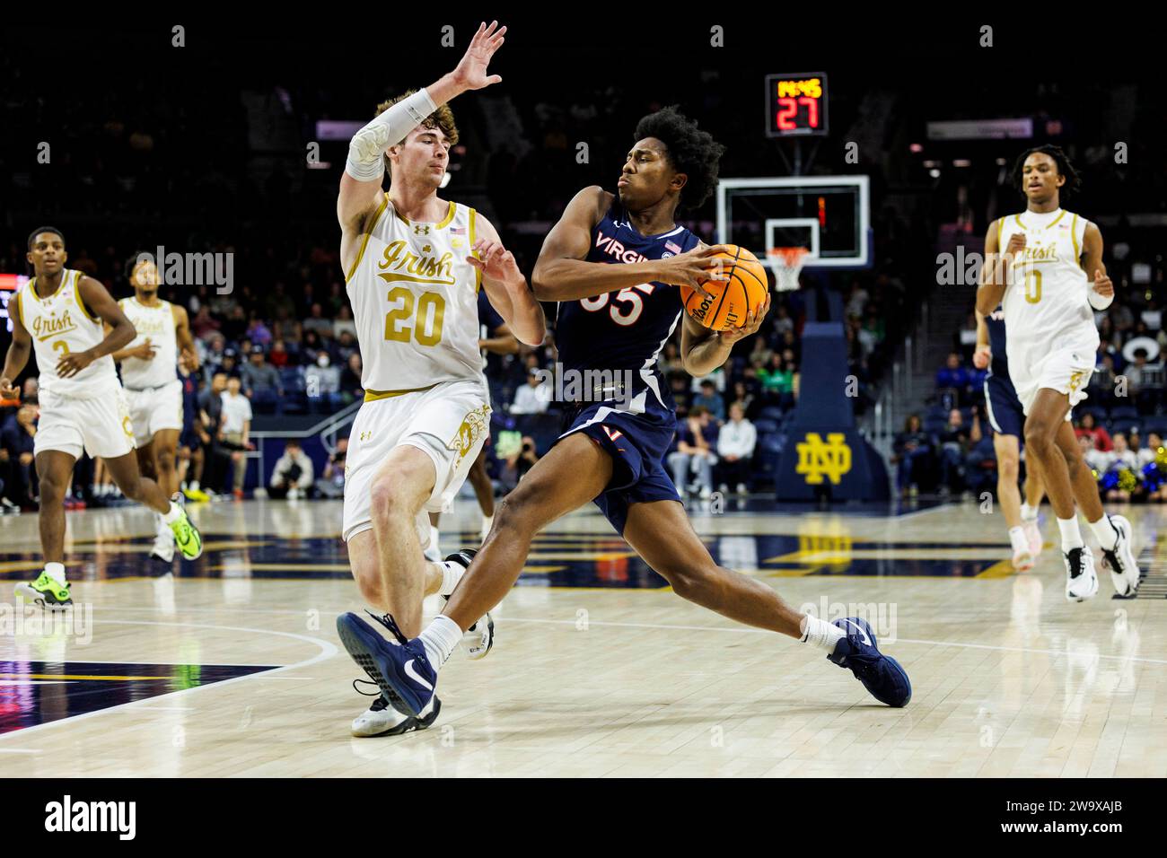 December 30, 2023: Virginia guard Leon Bond III (35) drives to the ...