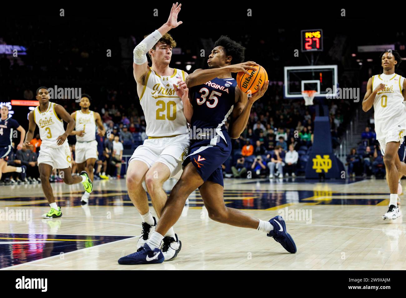 December 30, 2023: Virginia guard Leon Bond III (35) drives to the ...