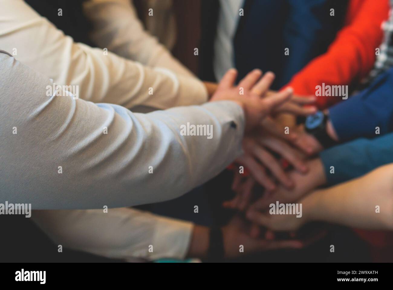 Group team of young people stacking hands together during contest ...