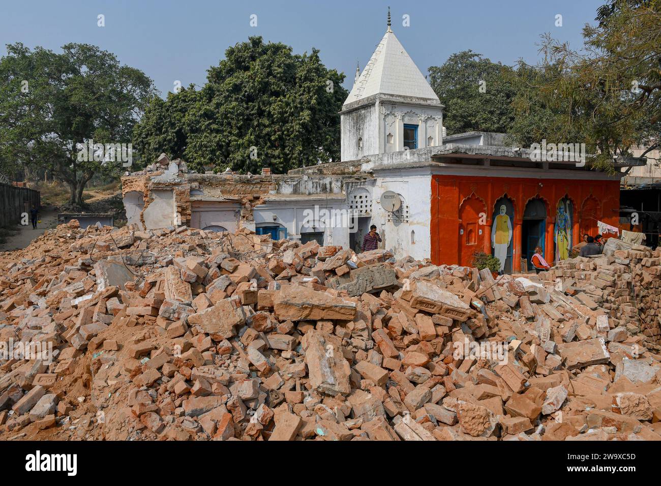 Ayodhya, India. 26th Dec, 2023. A demolished shop is seen in front of a ...