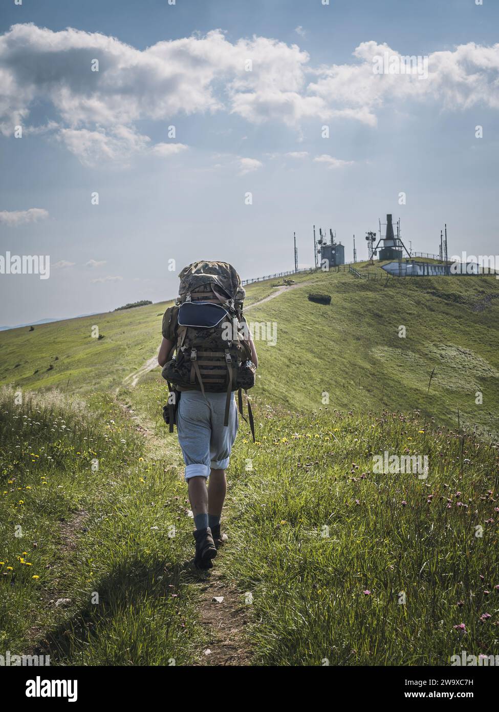 Group of adult backpacker hiker persons walking through a mountain ...
