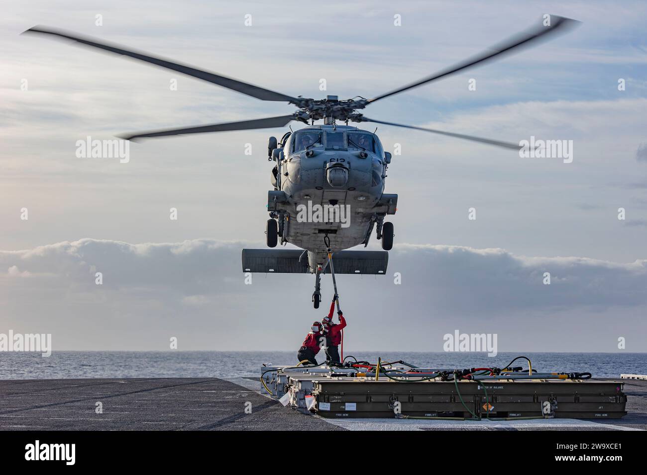 230118-N-LM220-1404 PACIFIC OCEAN (Jan. 20, 2023) An MH-60S Sea Hawk ...