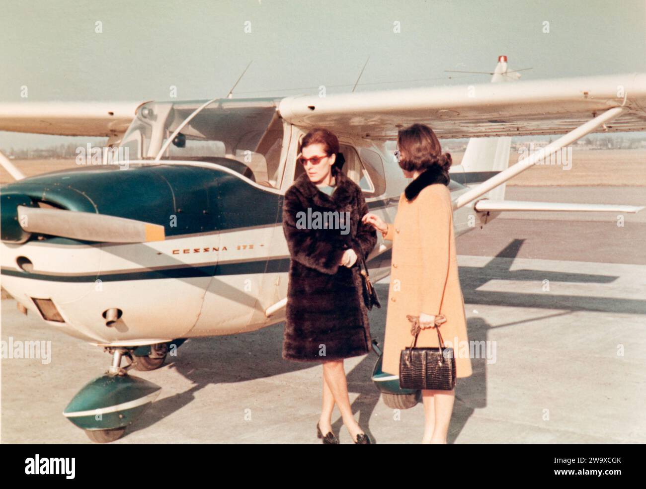 Two women chatting before a short flight over Milan in 1968 onboard a ...
