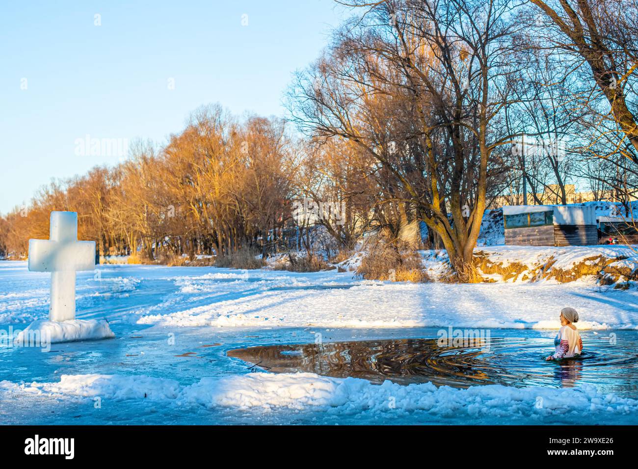 Christian symbol of the cross, made of a block of ice on the ice near ...