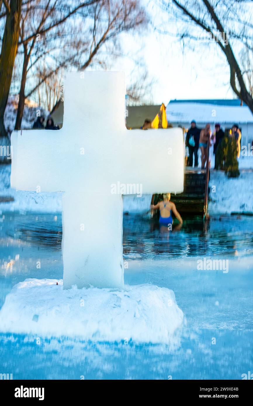 Christian symbol of the cross, made of a block of ice on the ice near ...