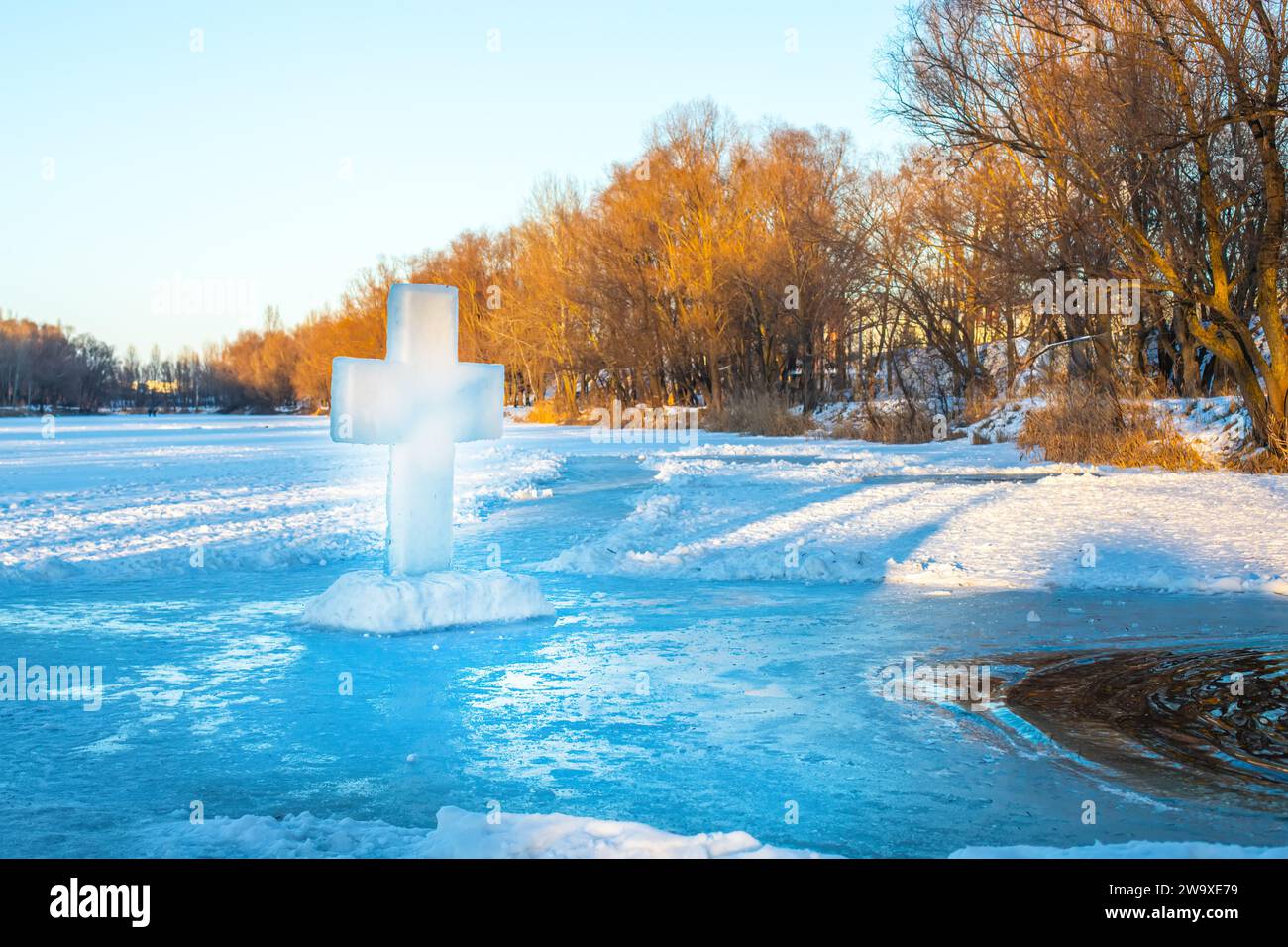 Christian symbol of the cross, made of a block of ice on the ice near ...