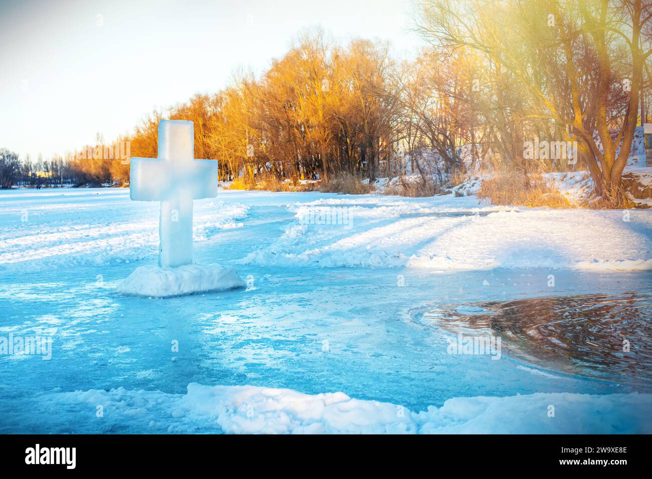 Christian symbol of the cross, made of a block of ice on the ice near ...